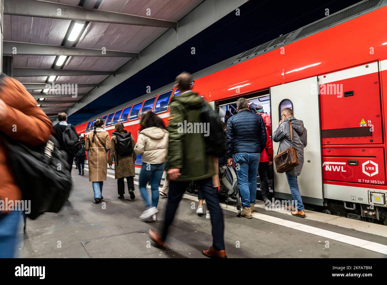 Train station, regional express train on platform, passengers, Essen ...