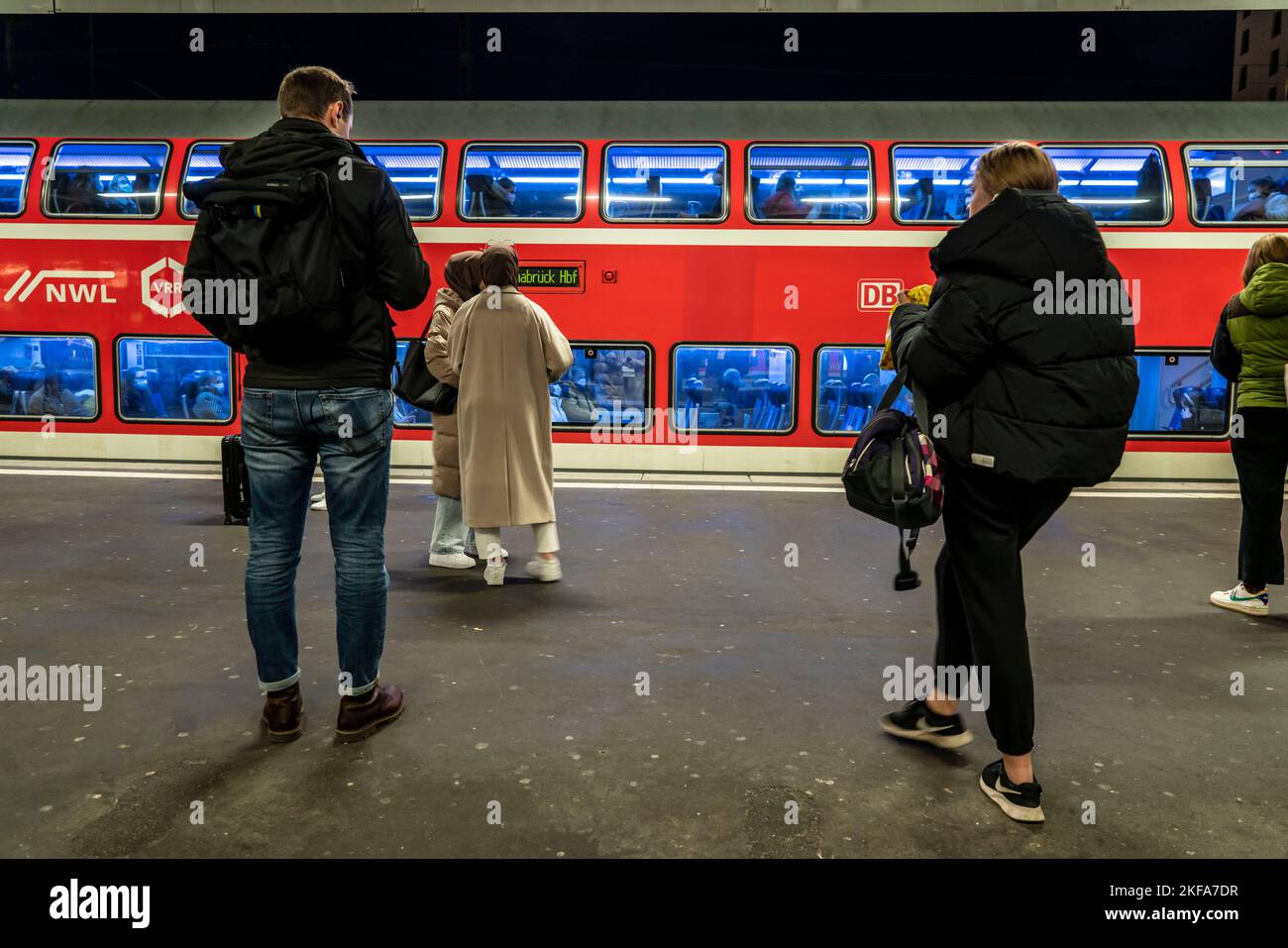 Train station, regional express train on platform, passengers, Essen ...