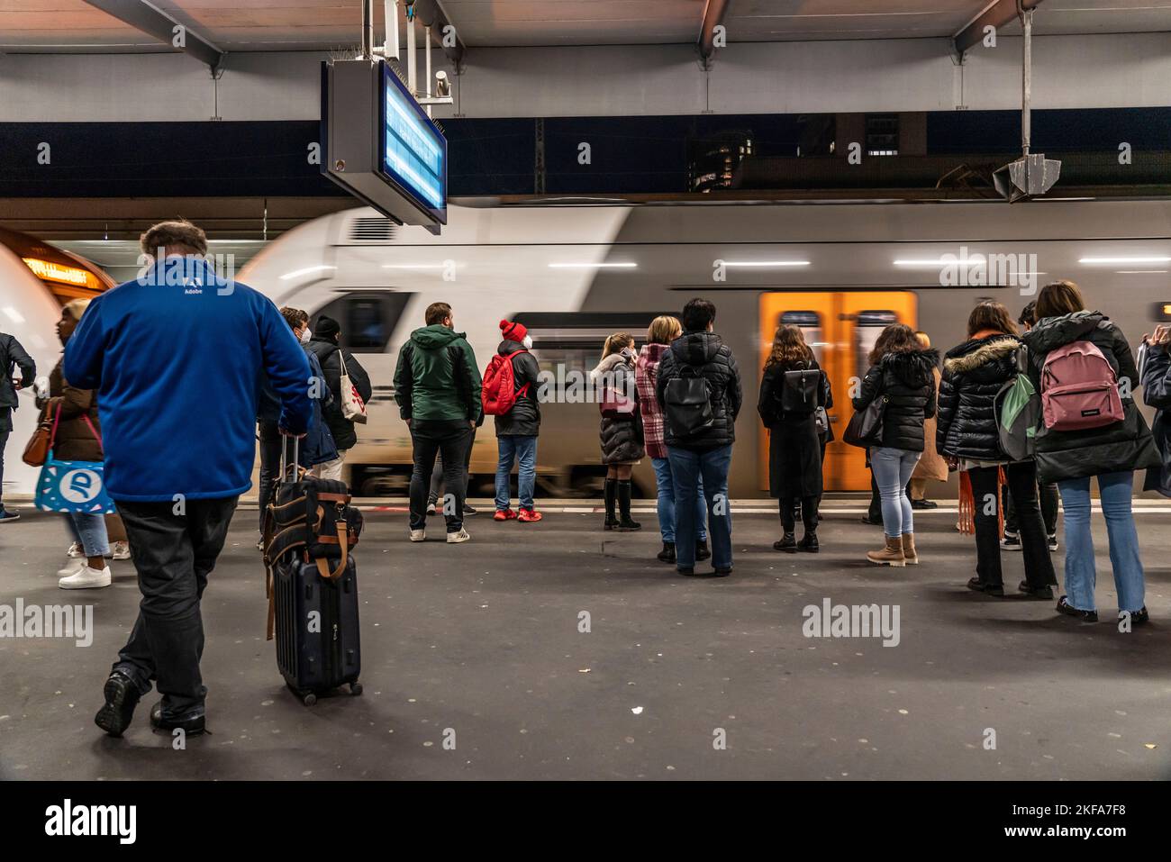 Train station, RRX regional express train on platform, passengers ...