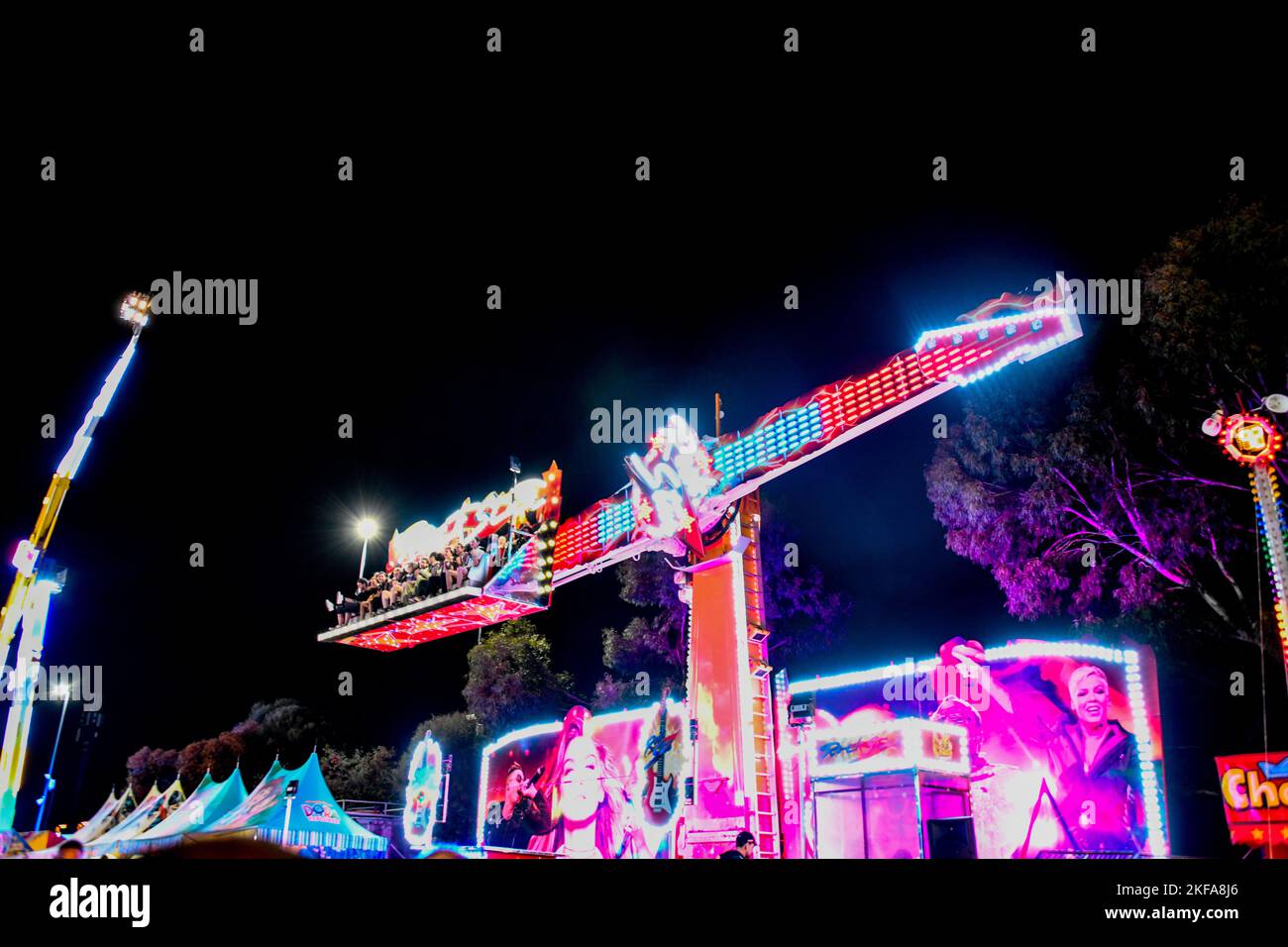 People Enjoying Fast Spinning Amusement Rides at The Royal Melbourne ...