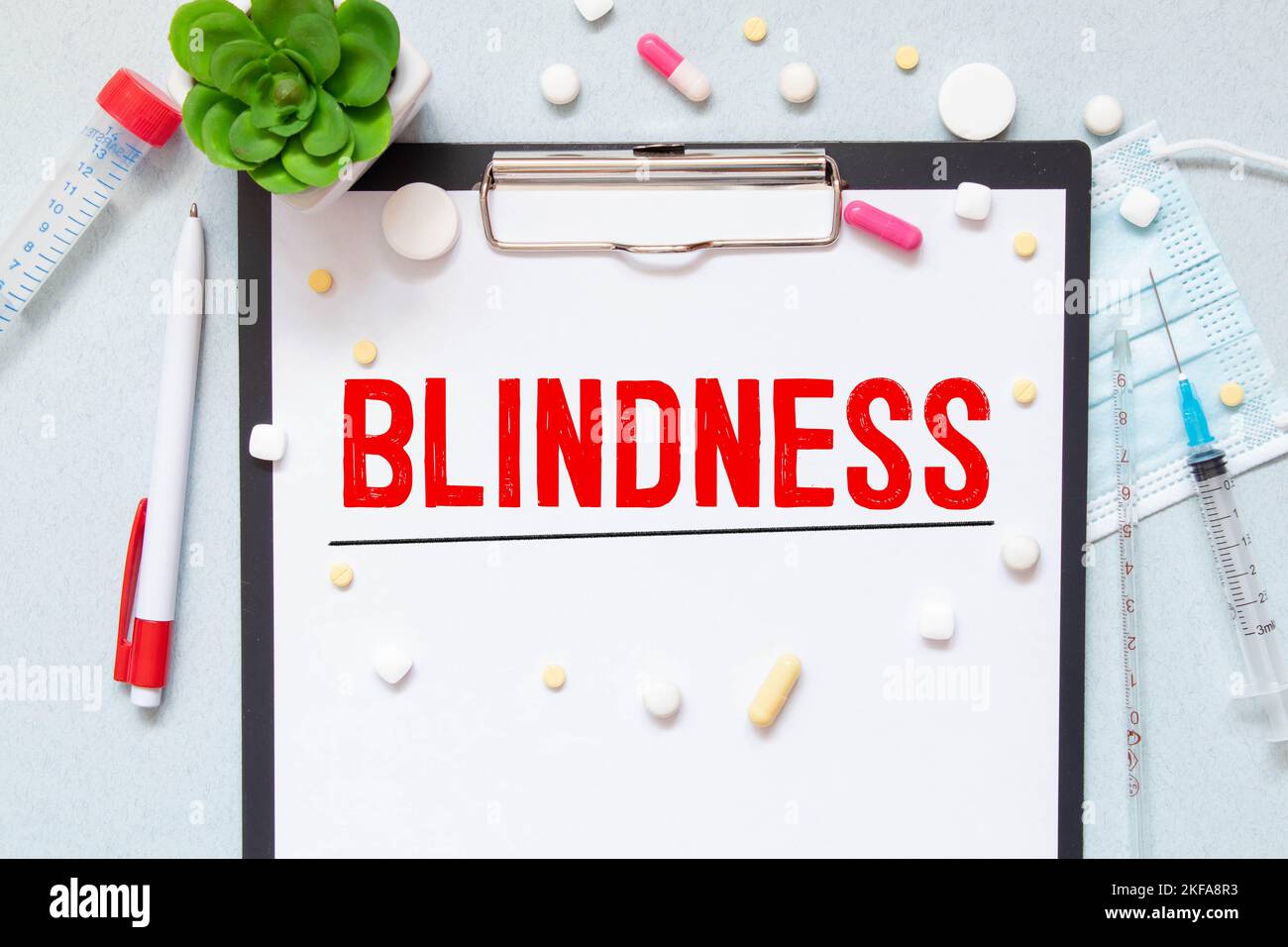 The fingers are touching the metal plate written in the Braille letters ...