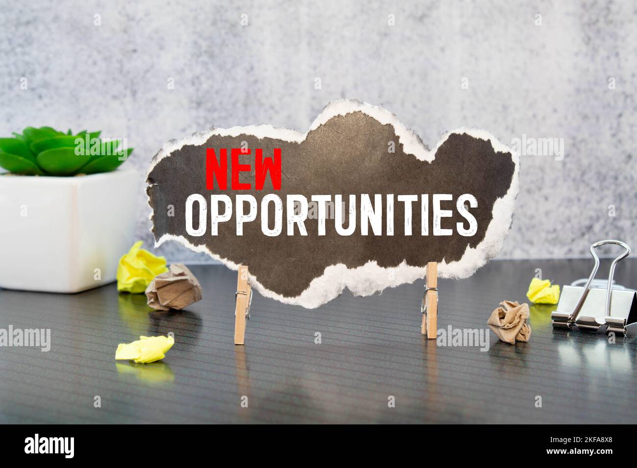 NEW DAY, NEW OPPORTUNITIES,the text is written in a notebook and on a ...