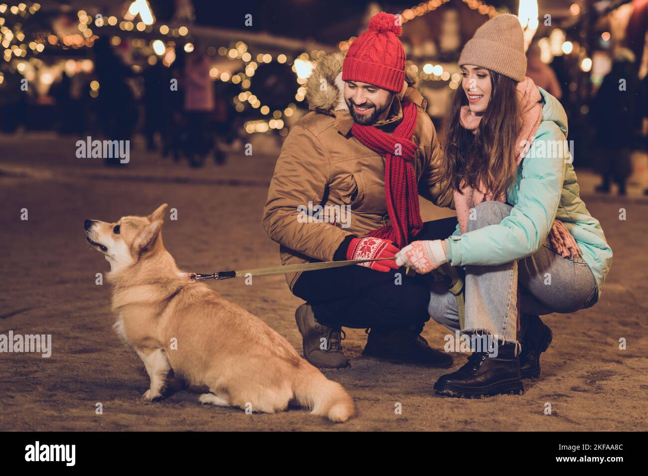 Photo of charming funky girlfriend boyfriend walking little corgi puppy ...