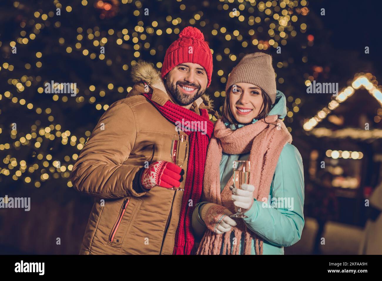 Photo of two cheerful friendly people hands hold champagne glass ...