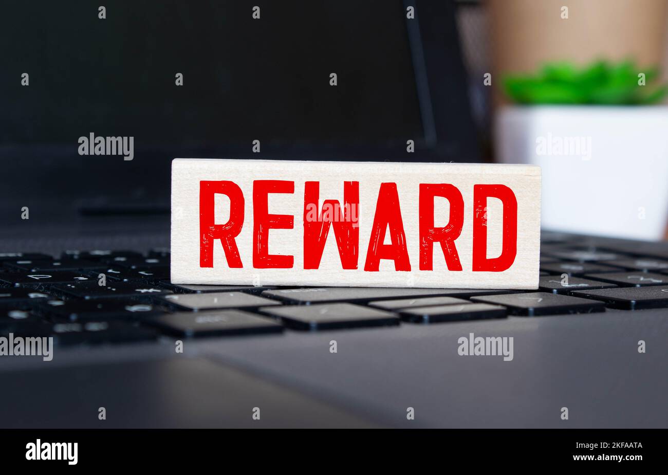reward word written on wood block Stock Photo - Alamy