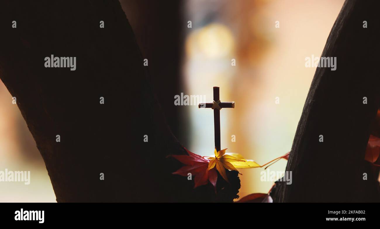 Holy cross of Jesus Christ and bible book among autumn leaves, red ...