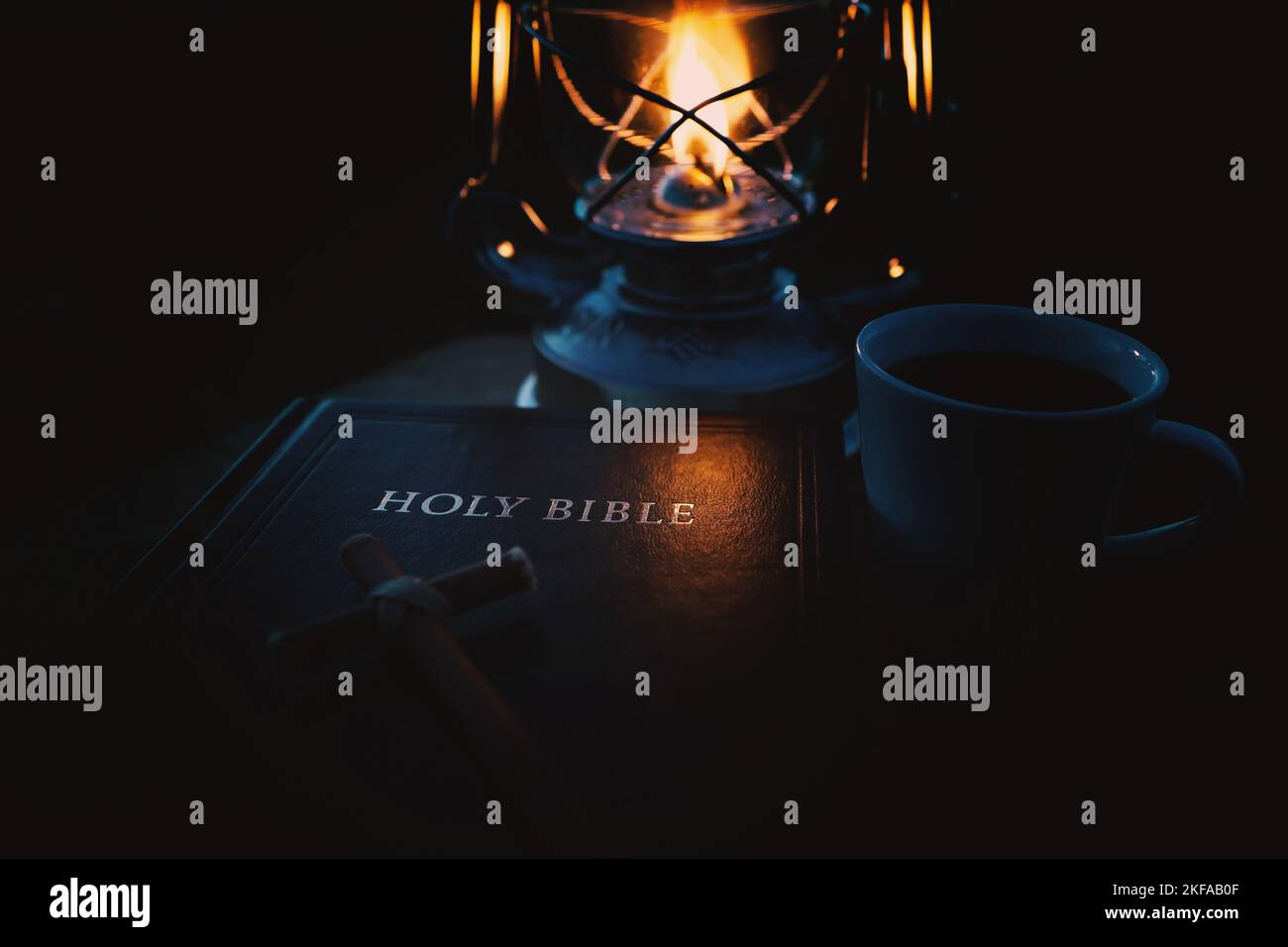 Dark night comfortable bright burning lamp and glowing holy bible and ...