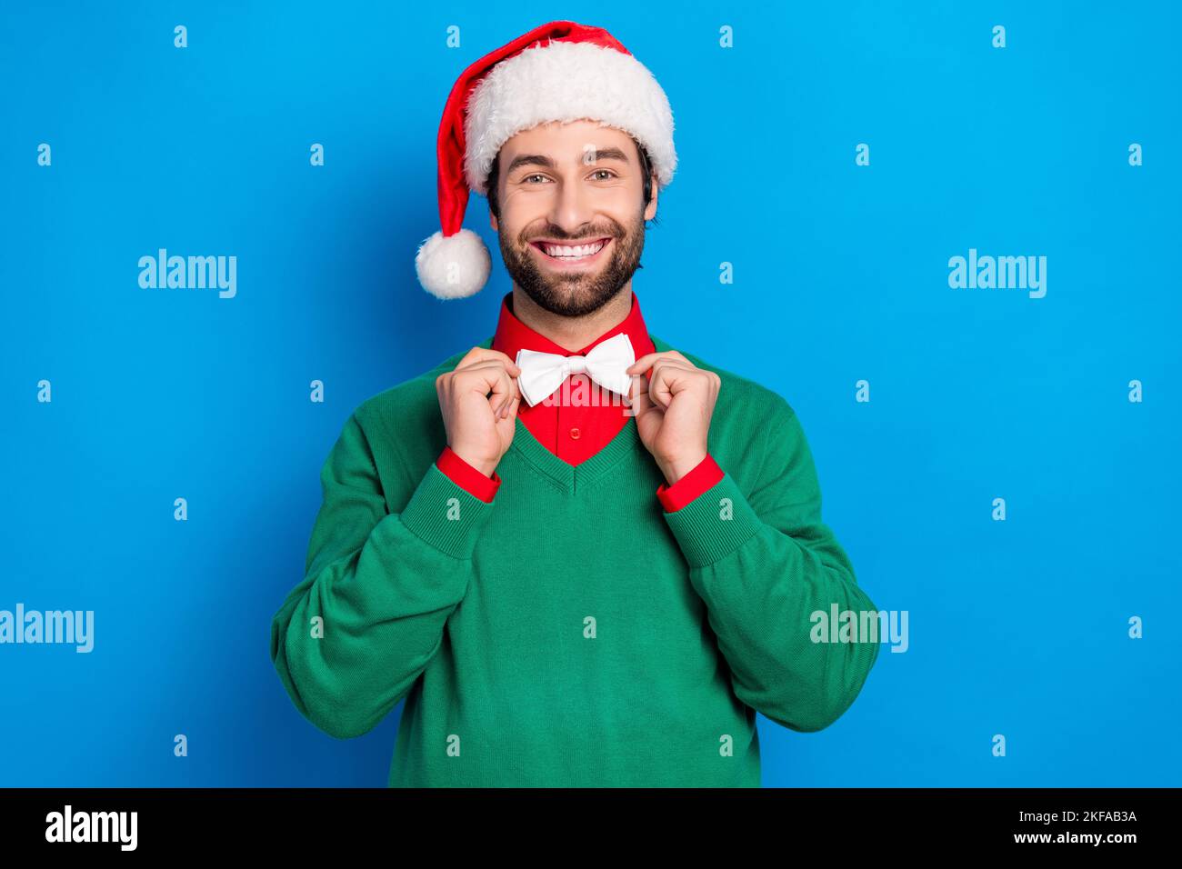 Photo of neat dandy cheerful man hands touch fix bowtie beaming smile ...