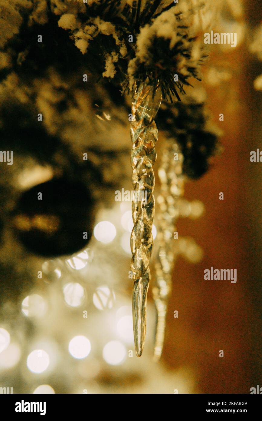 Icicles hanging on a Christmas tree close-up. A decor concept for ...