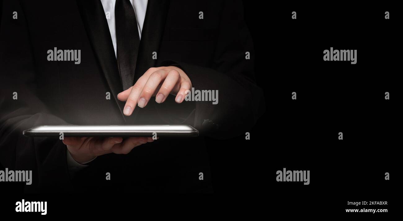 Business person touching screen of a tablet with white light screen on ...