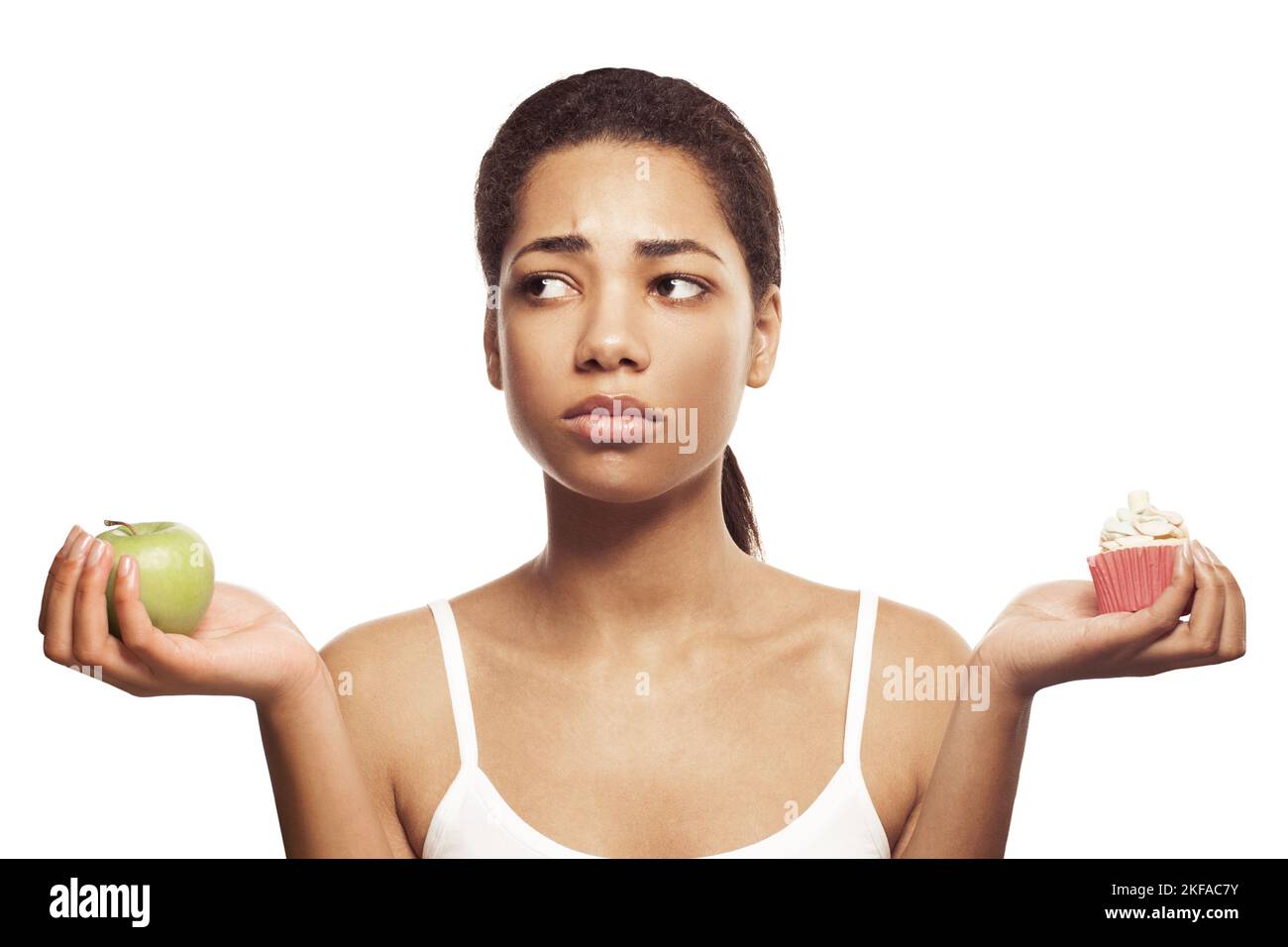 Diet. Young woman with fruit and cake portrait Stock Photo - Alamy