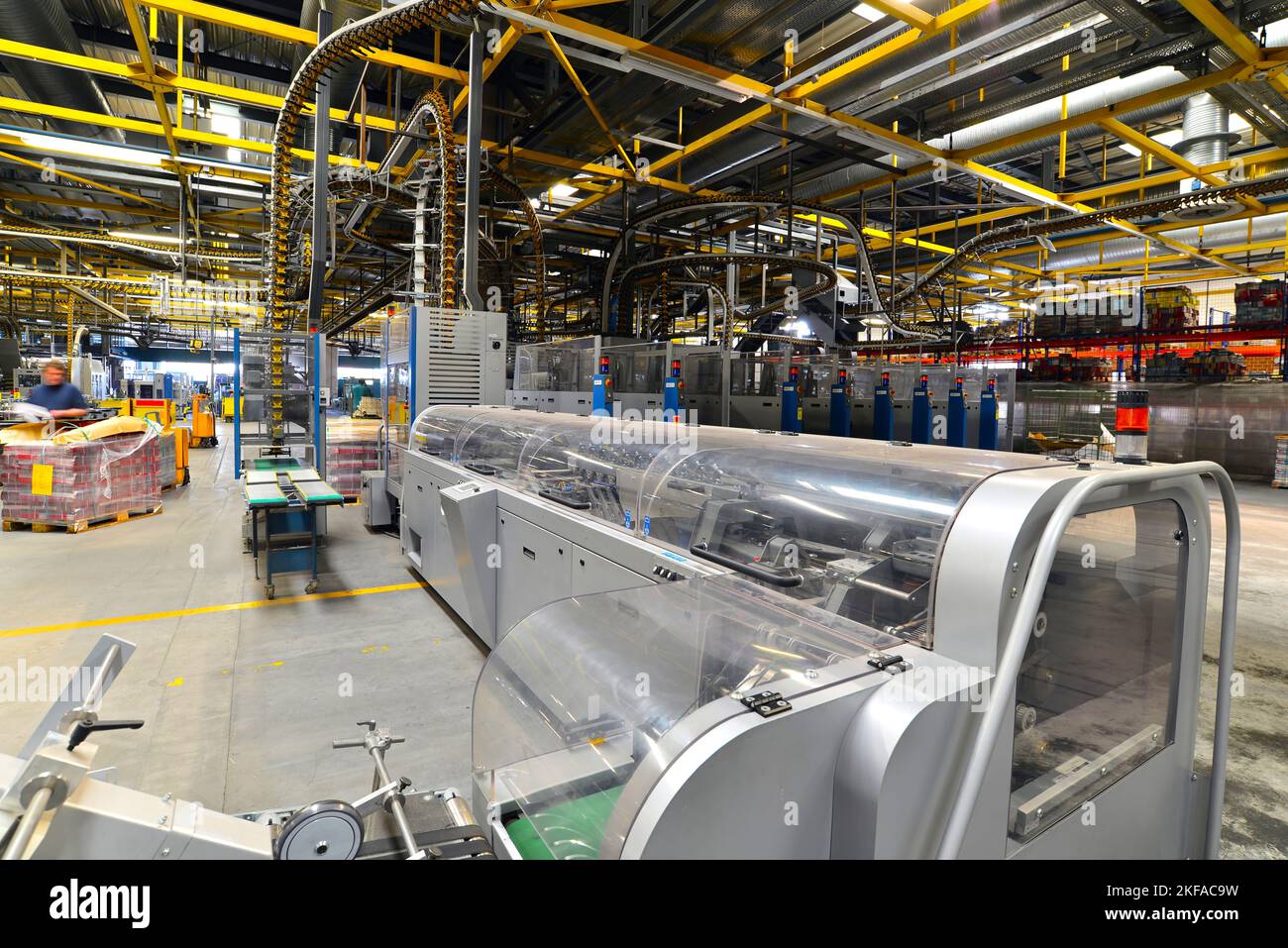 modern machines for transportation in a large print shop for production ...