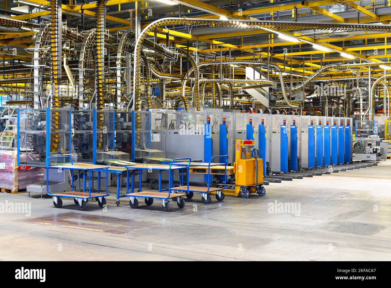 modern machines for transportation in a large print shop for production ...