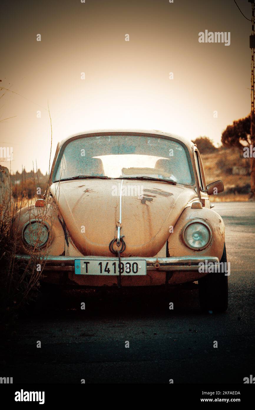 A vertical view of an old beetle car in front of sunset Stock Photo - Alamy