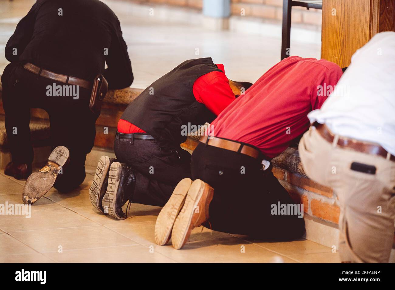The people kneeling and praying in church Stock Photo - Alamy