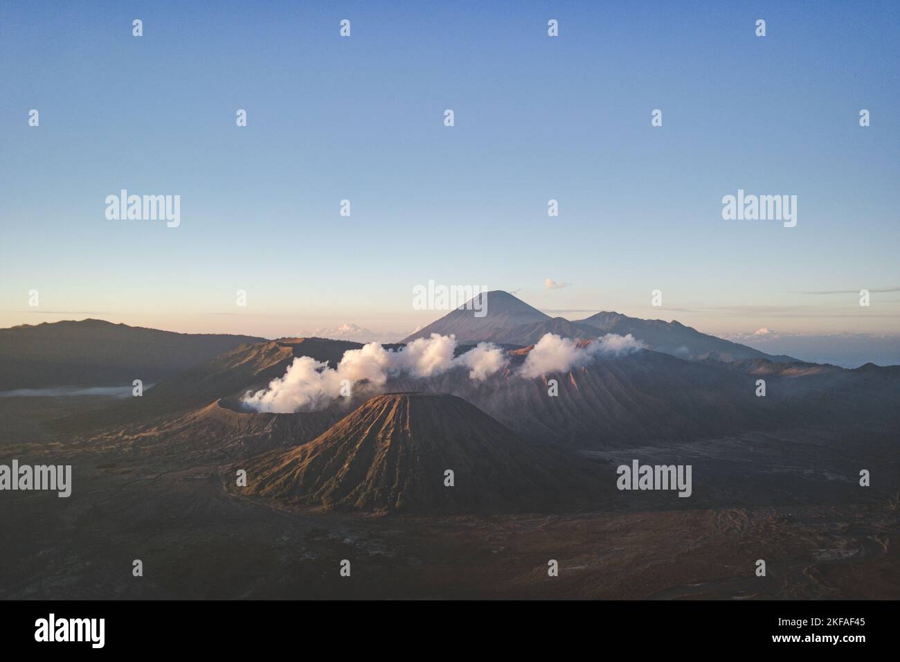 A bird's eye view of Mount Bromo smoking at sunset in Indonesia Stock ...