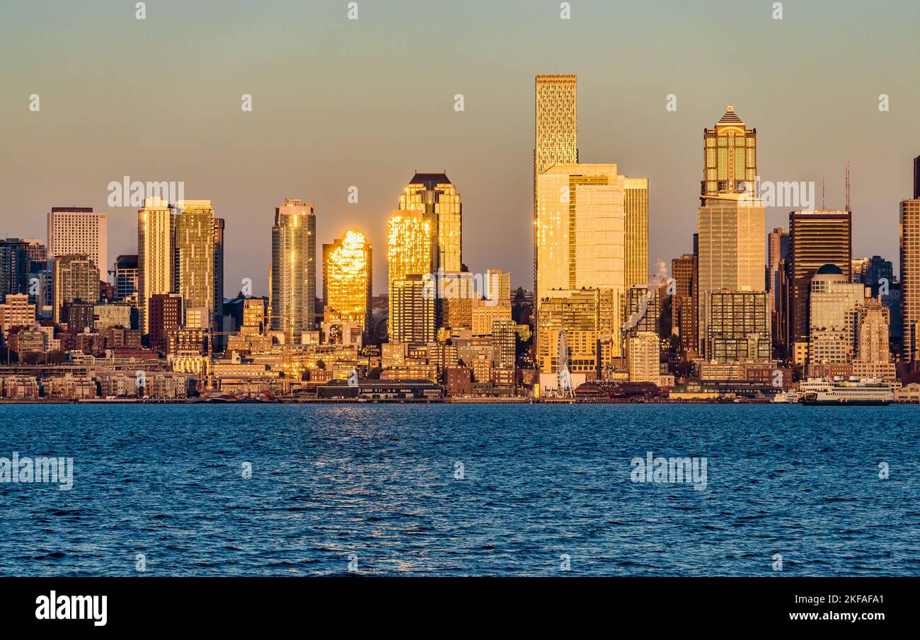 Sunlight reflects from buildings of the Seattle skyline in Washington ...