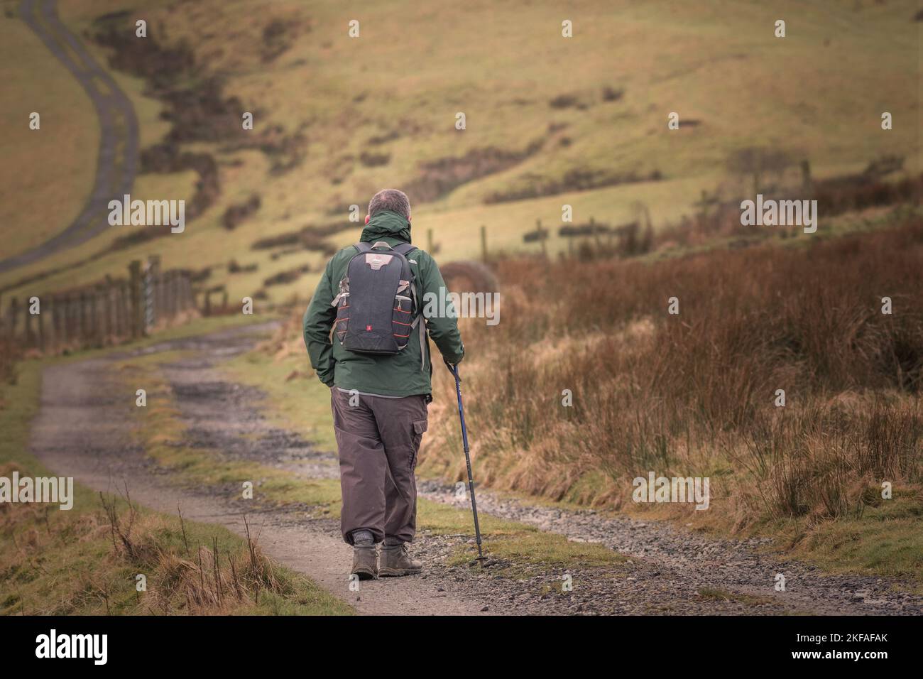 Senior citizen walking and exercising in the countryside. Walking with ...