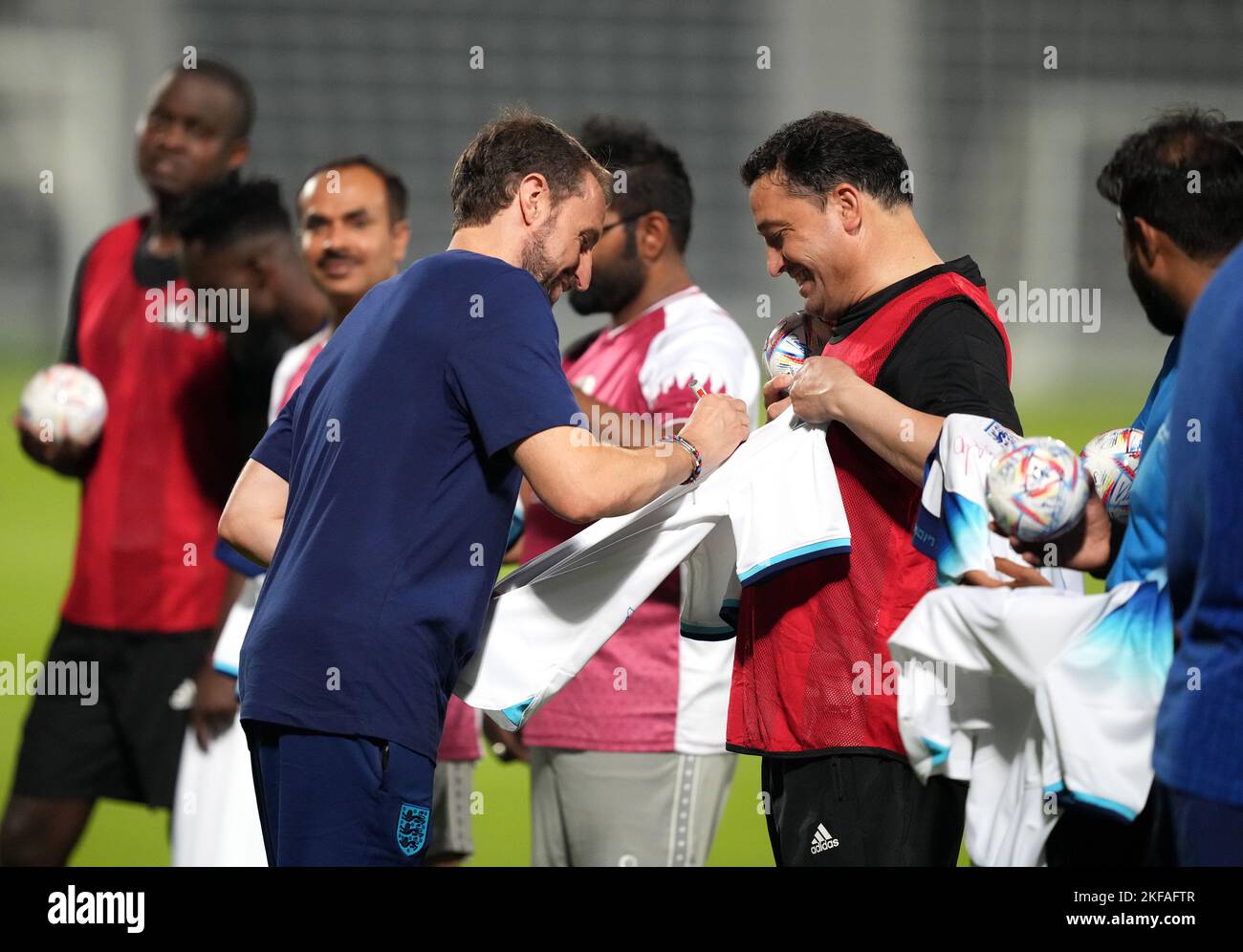 England manager Gareth Southgate signs shirts for the Workers' Welfare ...