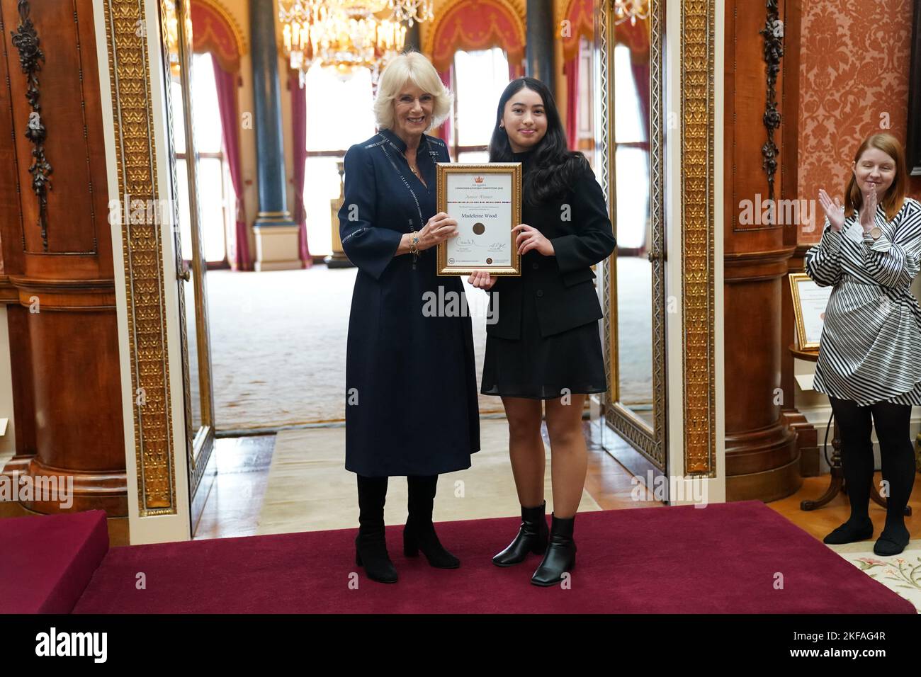 The Queen Consort with Madeleine Wood during a reception for winners of ...