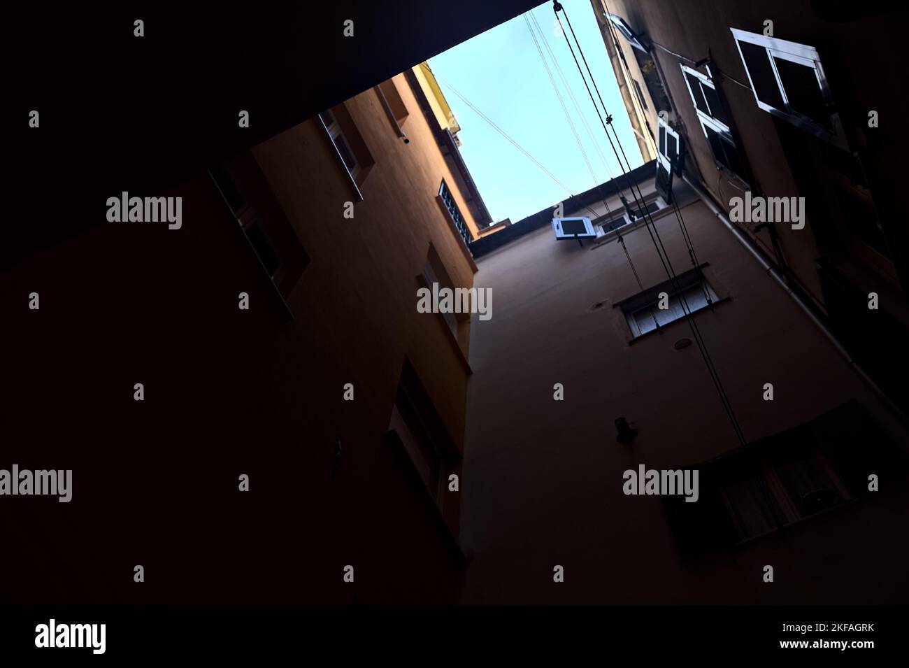 Opening between tall and narrow buildings Stock Photo - Alamy