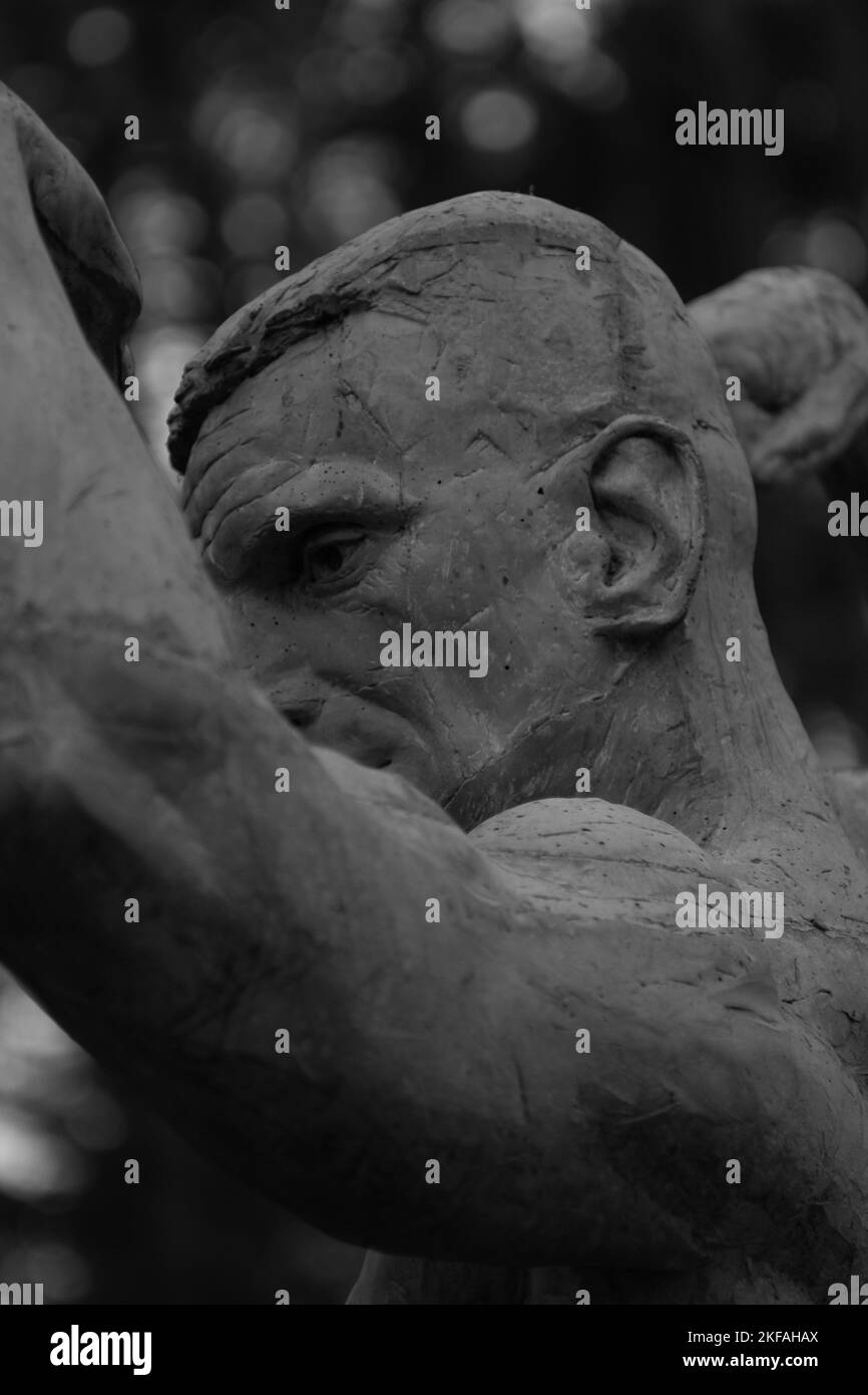 A black and white shot of a male statue in the park in Vilnius Stock ...