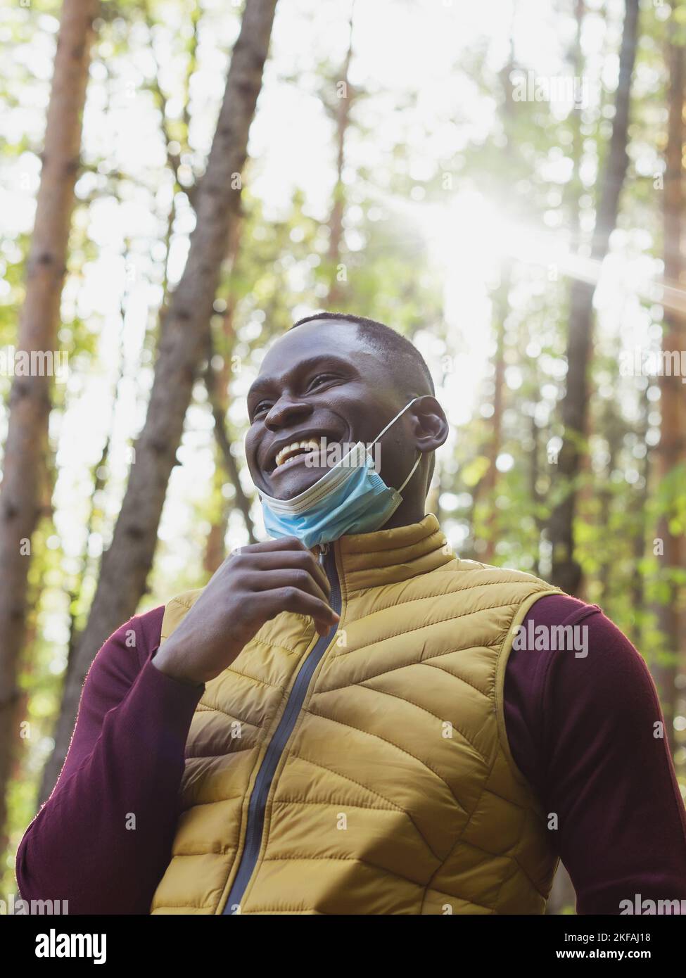 Handsome african american man wearing casual clothes and medical mask ...