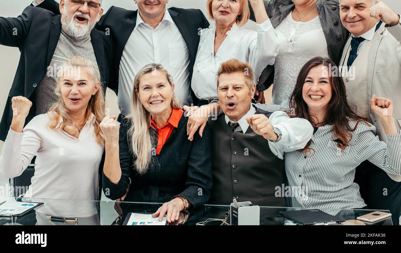 large group of experienced employees in the workplace in the office ...