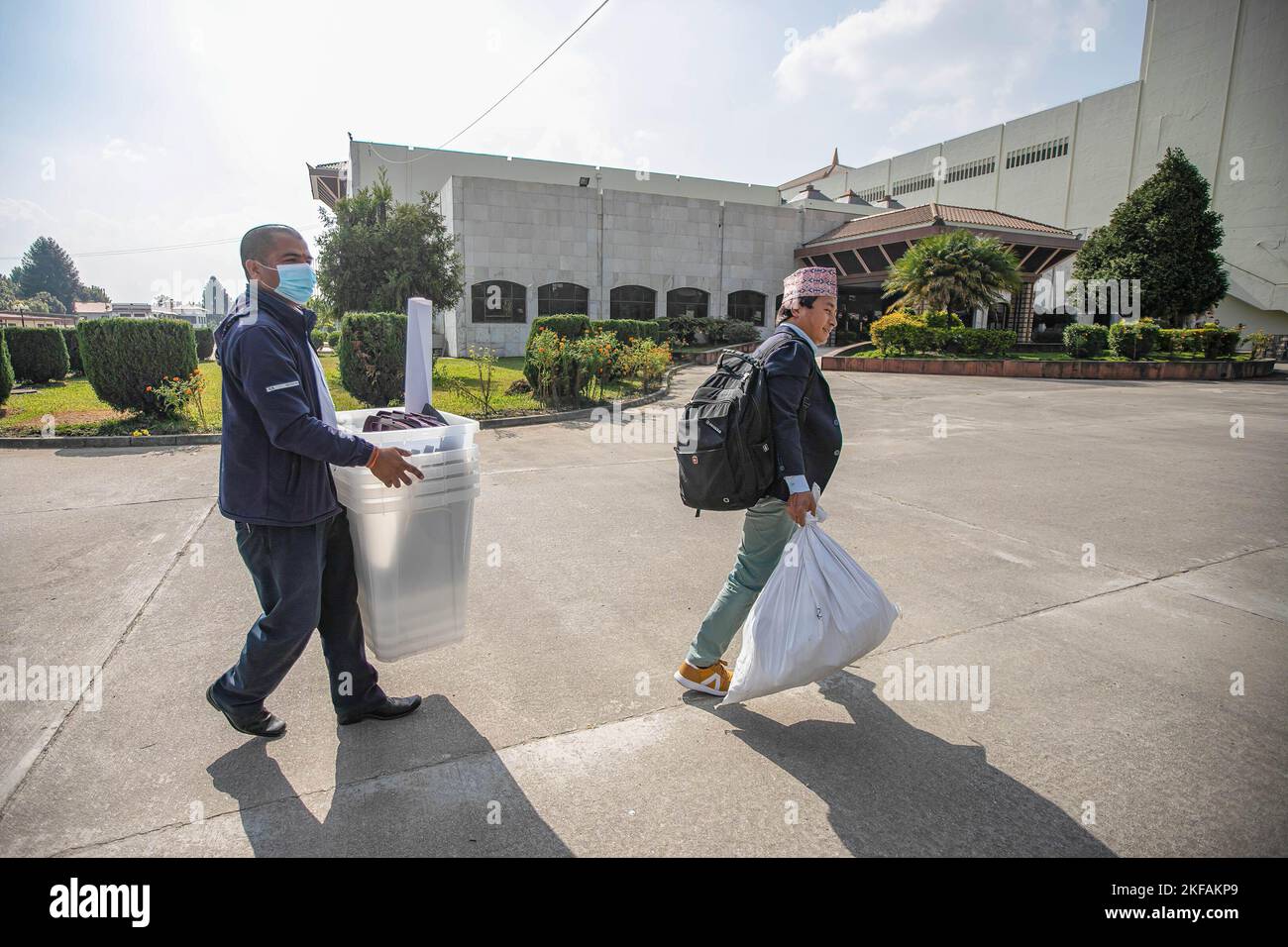 The election commission officers collect the ballot box and election ...