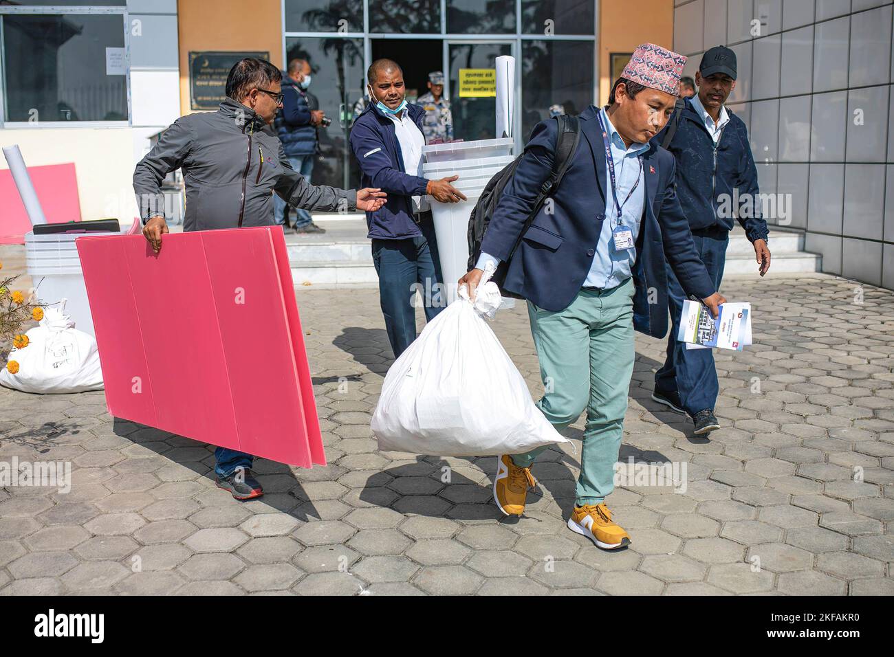 The election commission officers collect the ballot box and election ...