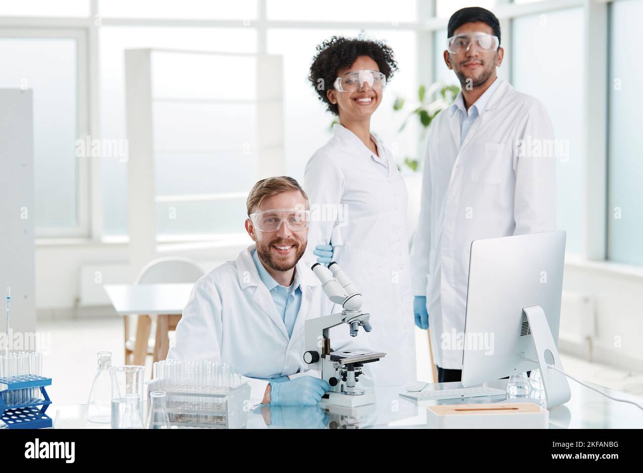 group of employees of a scientific medical laboratory at the workplace ...