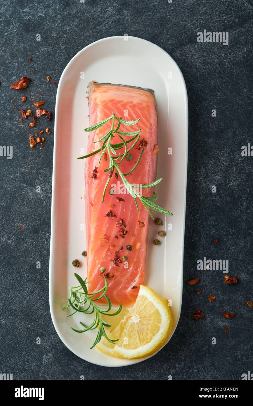 Salmon fish piece. Fresh raw salmon fish piece on marble board stand ...