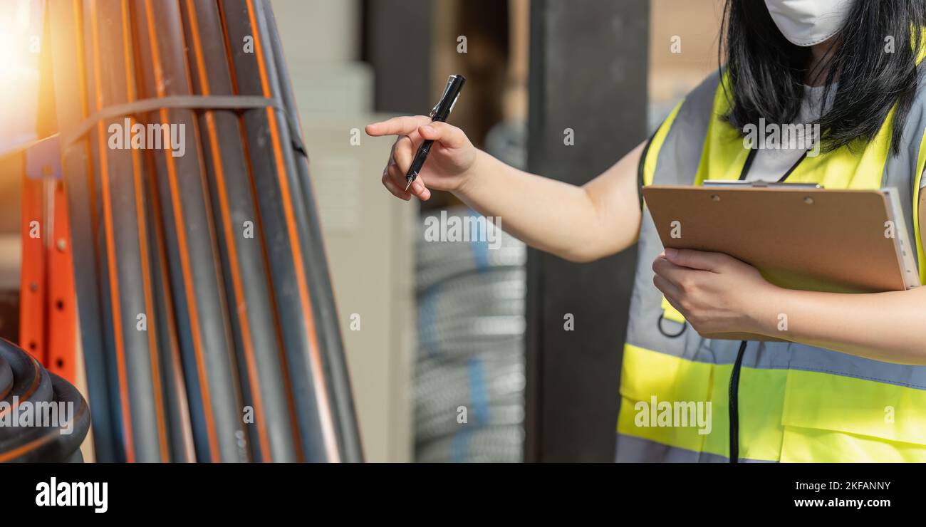 Working at warehouse. Male warehouse worker checking in storage ...