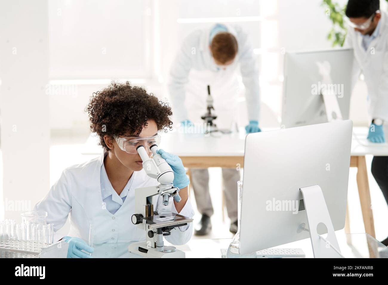 Group scientists conducting research hi-res stock photography and ...