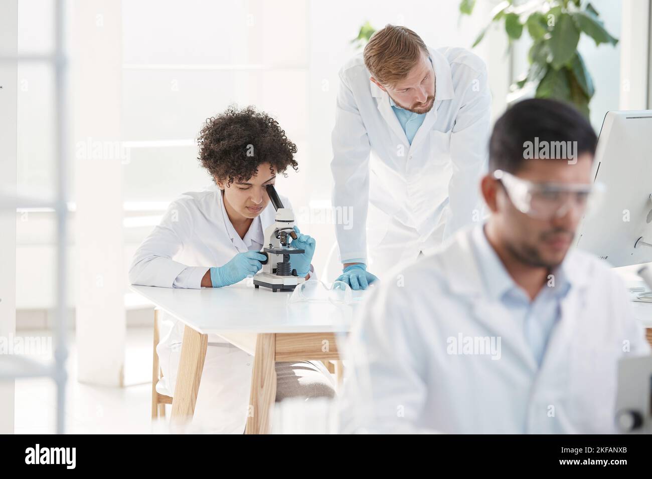 scientist and his colleagues work in a medical laboratory Stock Photo ...