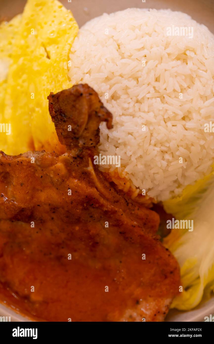 top view dish of pork rib with egg and cabbage and rice vertical ...