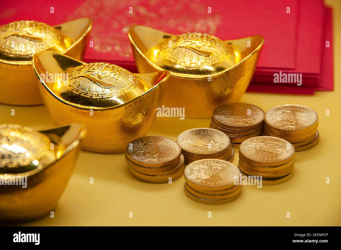 Chinese New Year packets with Chinese Gold Ingots and gold coins on ...