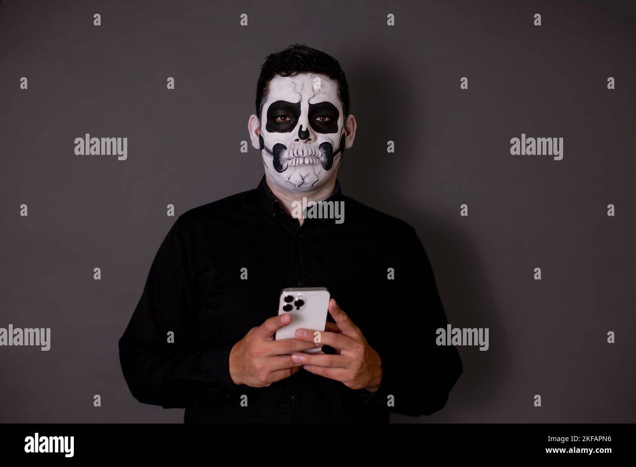 man in catrin or skull makeup for day of the dead as mexican tradition ...