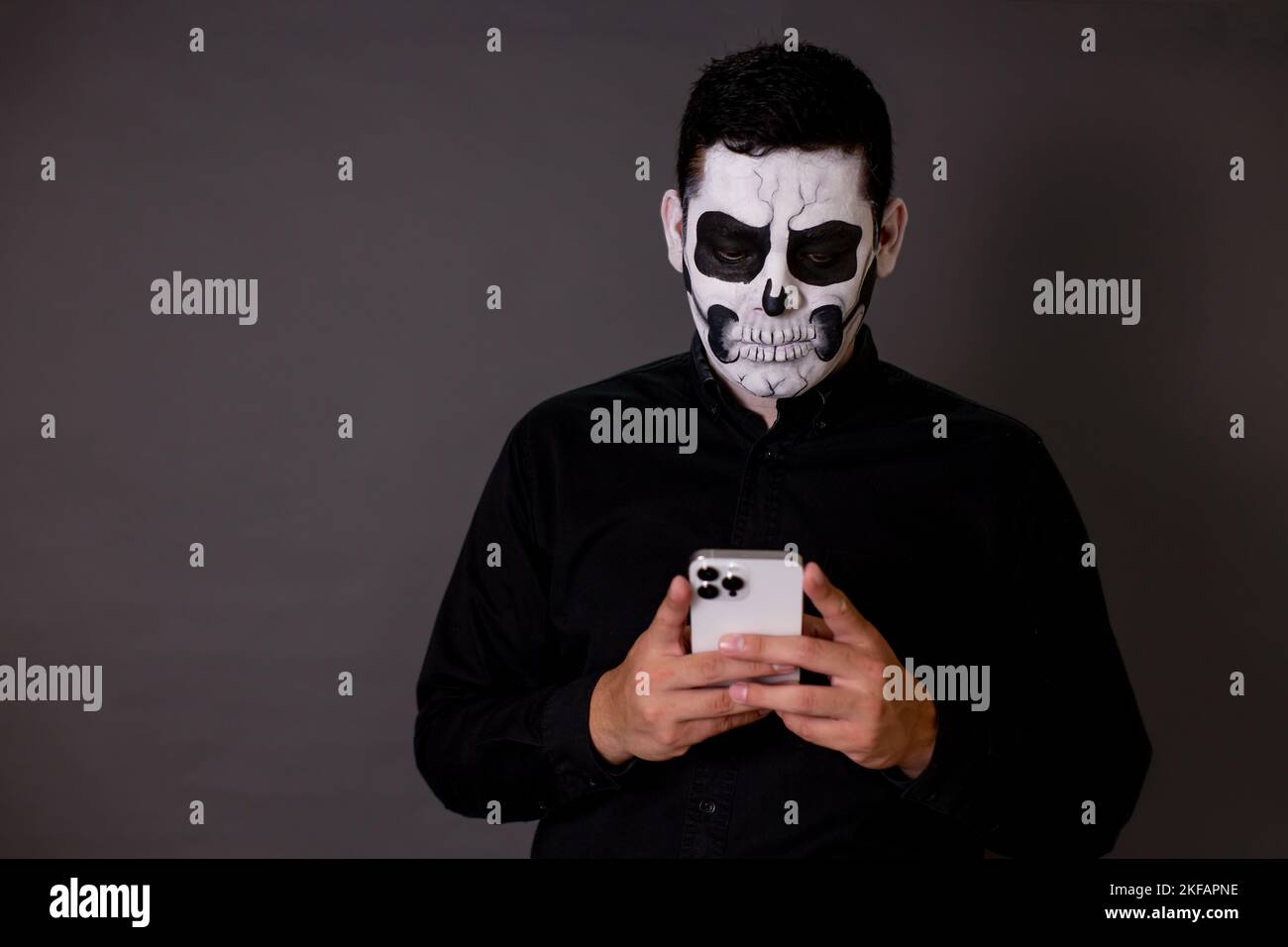 man in catrin or skull makeup for day of the dead as mexican tradition ...