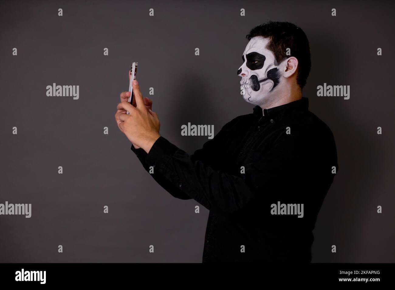 man in catrin or skull makeup for day of the dead as mexican tradition ...