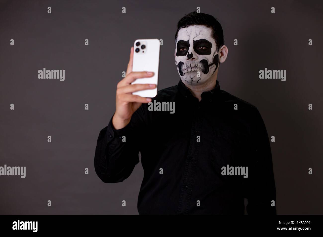 man in catrin or skull makeup for day of the dead as mexican tradition ...