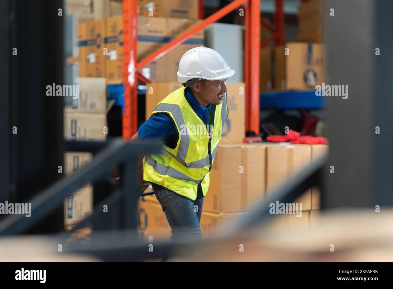 Working at warehouse. Male warehouse worker checking in storage ...