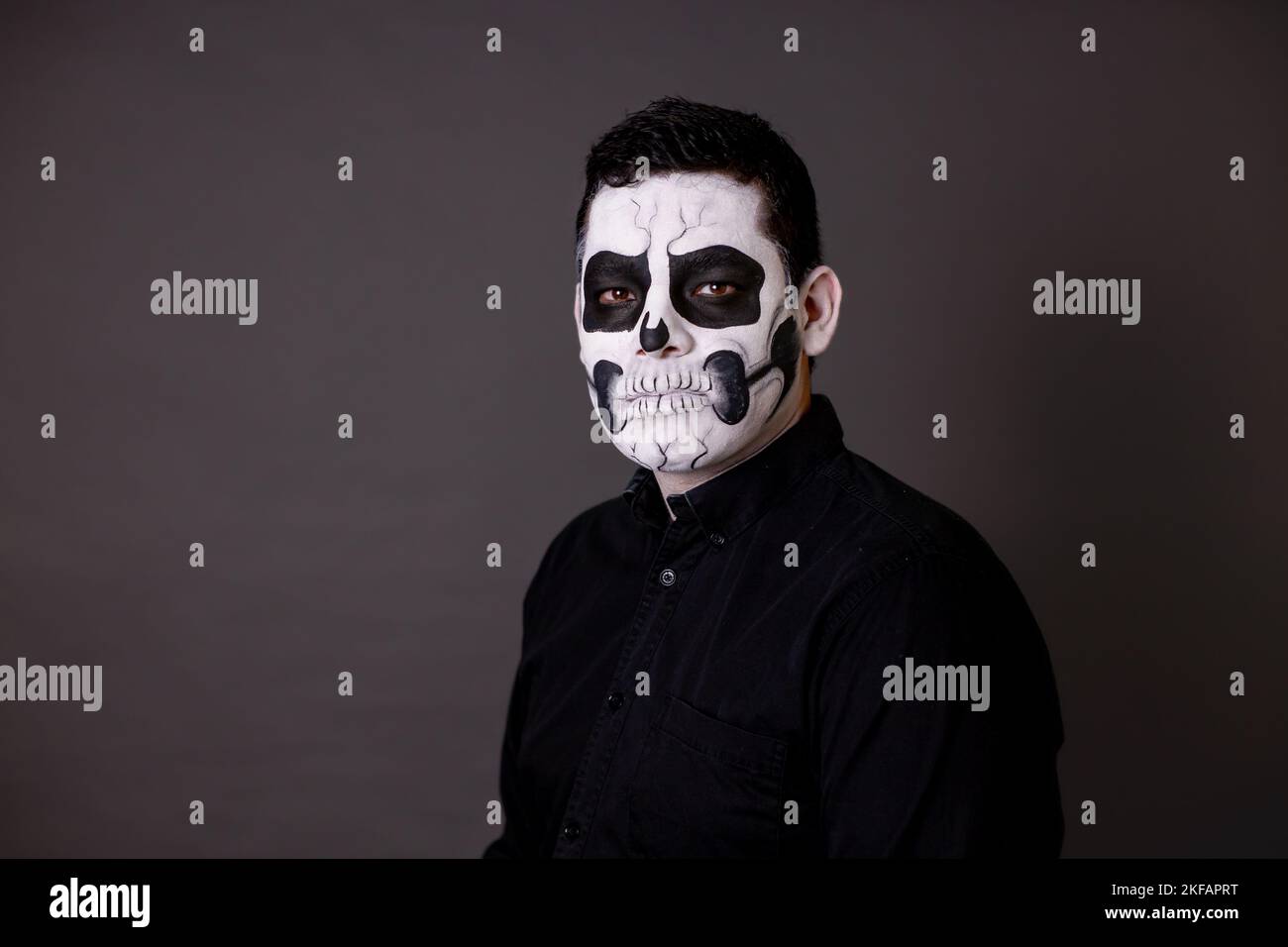man in catrin or skull makeup for day of the dead as mexican tradition ...