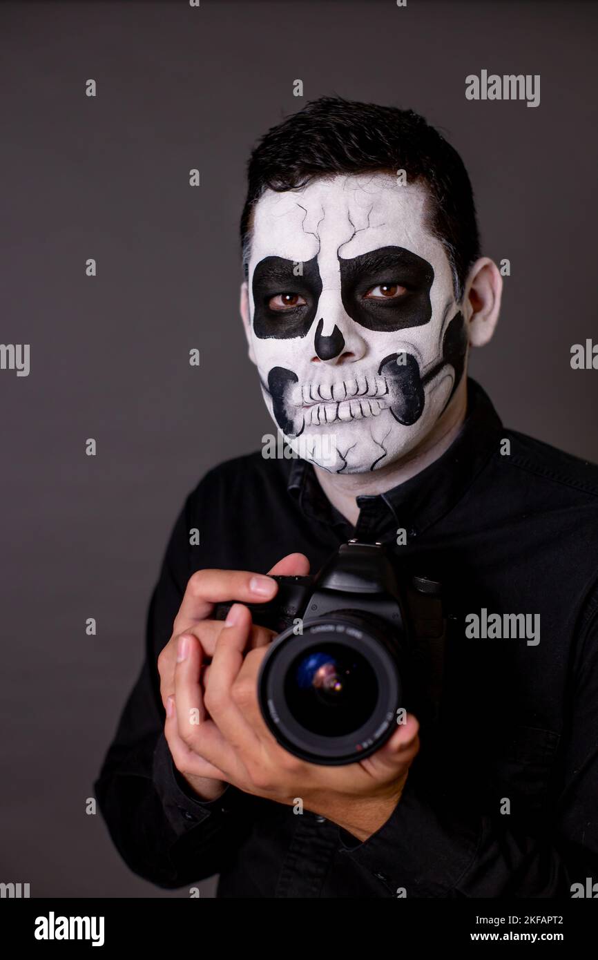 man in catrin or skull makeup for day of the dead as mexican tradition ...