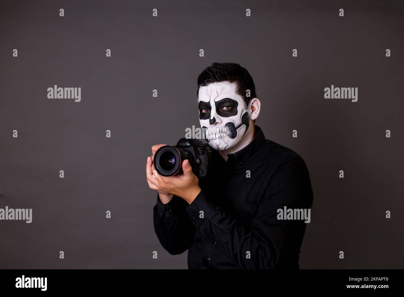 man in catrin or skull makeup for day of the dead as mexican tradition ...