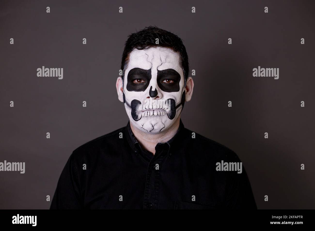 man in catrin or skull makeup for day of the dead as mexican tradition ...