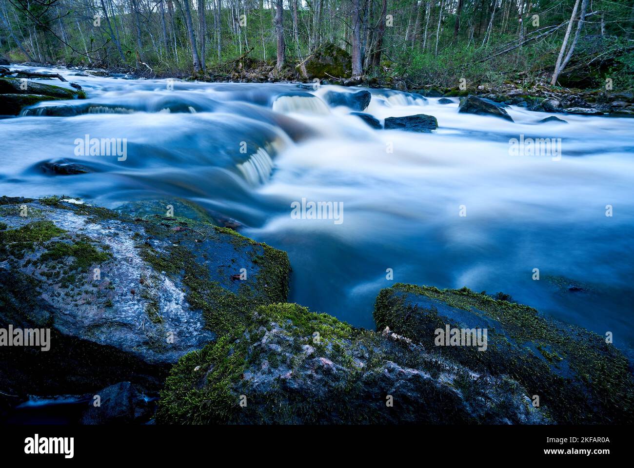 Fast flowing wide river in spring time Stock Photo - Alamy