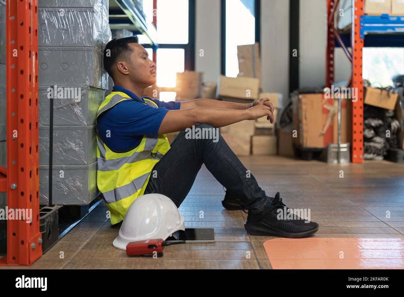 Working at warehouse. Male warehouse worker checking in storage ...