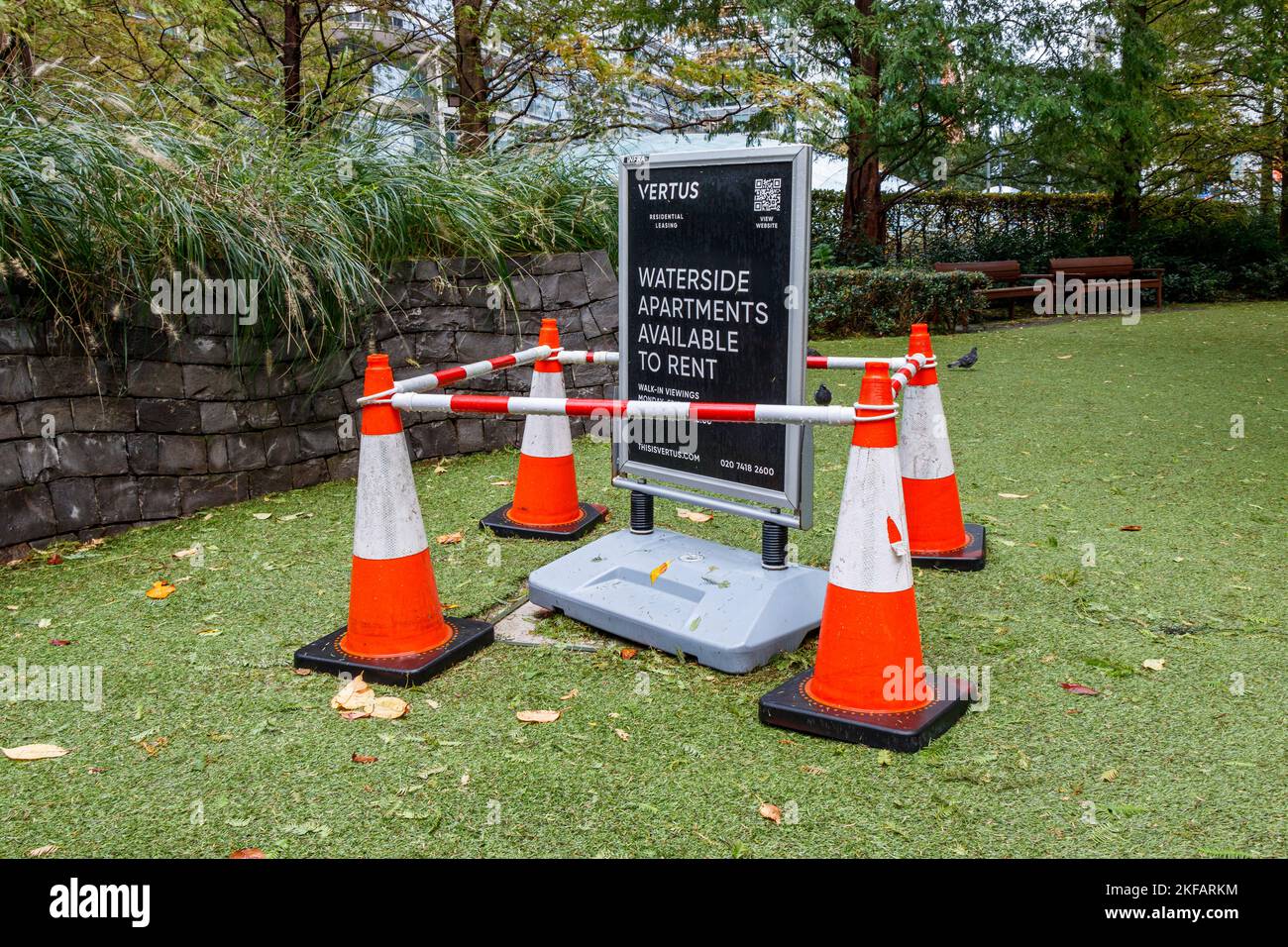An advertisement for rental waterside apartments cordoned off by four ...