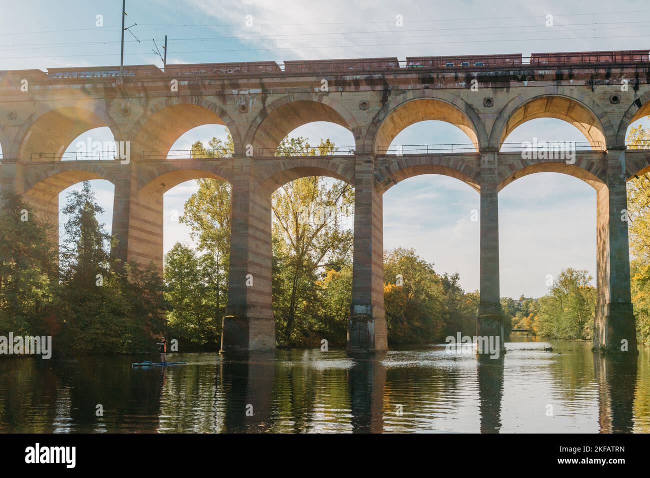 Germany train passing train bridge on cloudy day in germany hi-res ...